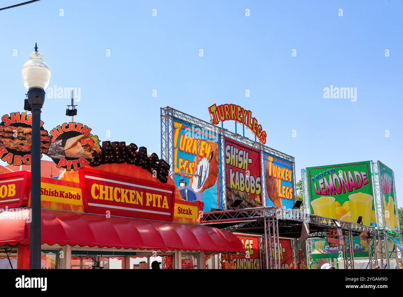 USA, Indiana, Indianapolis. Food vendor booths with colorful signage at ...