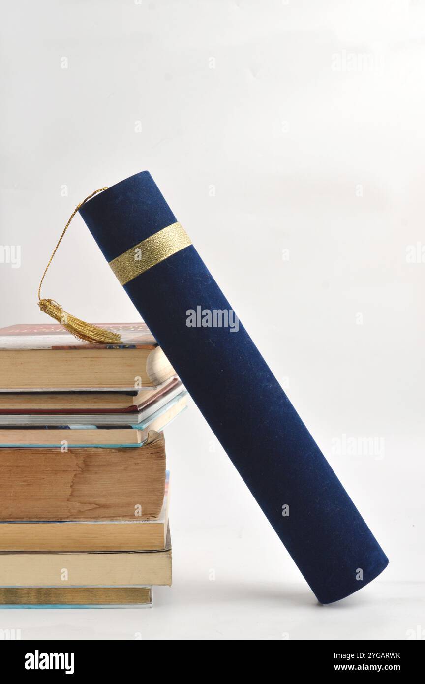 stacks of books and diploma on white background Stock Photo - Alamy