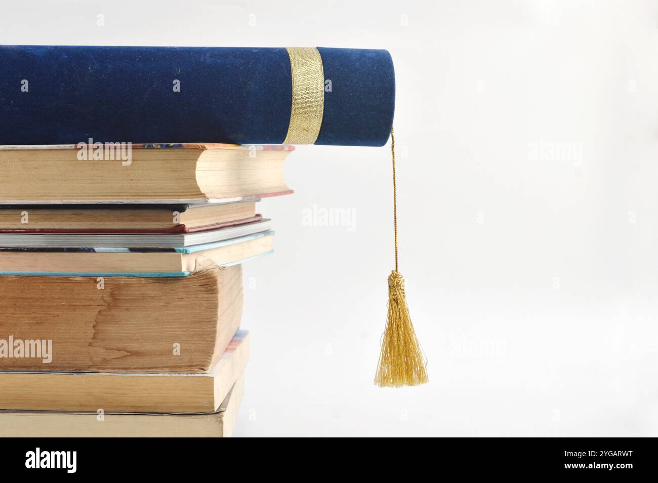 stacks of books and diploma on white background Stock Photo - Alamy