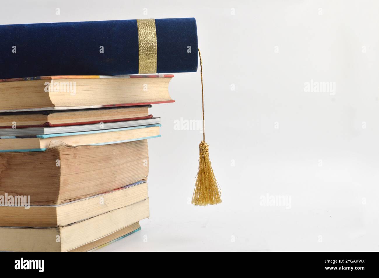 stacks of books and diploma on white background Stock Photo - Alamy