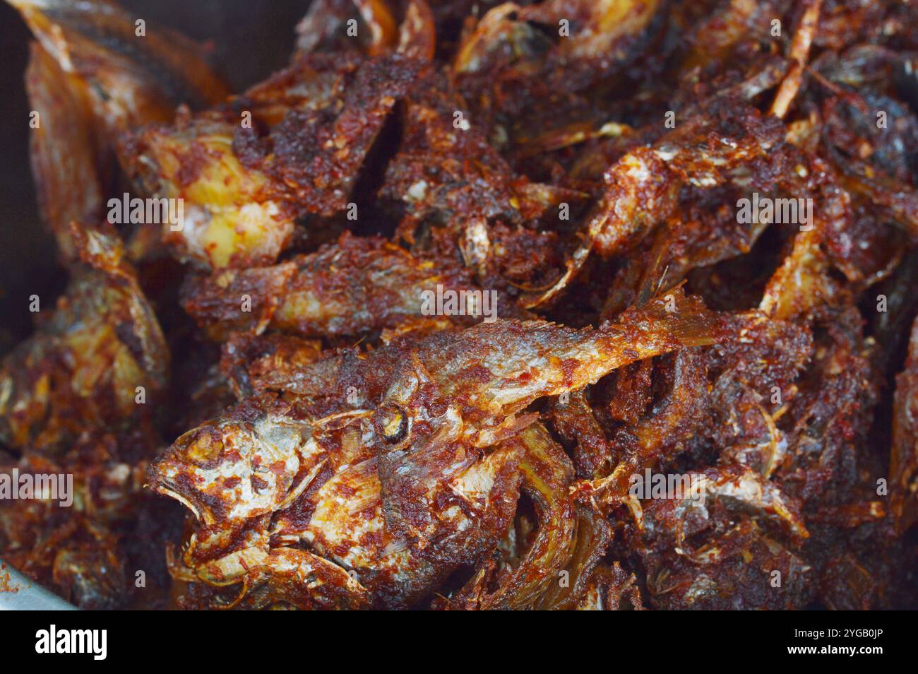 Indonesian Fried dried fish with spicy seasoning Stock Photo - Alamy