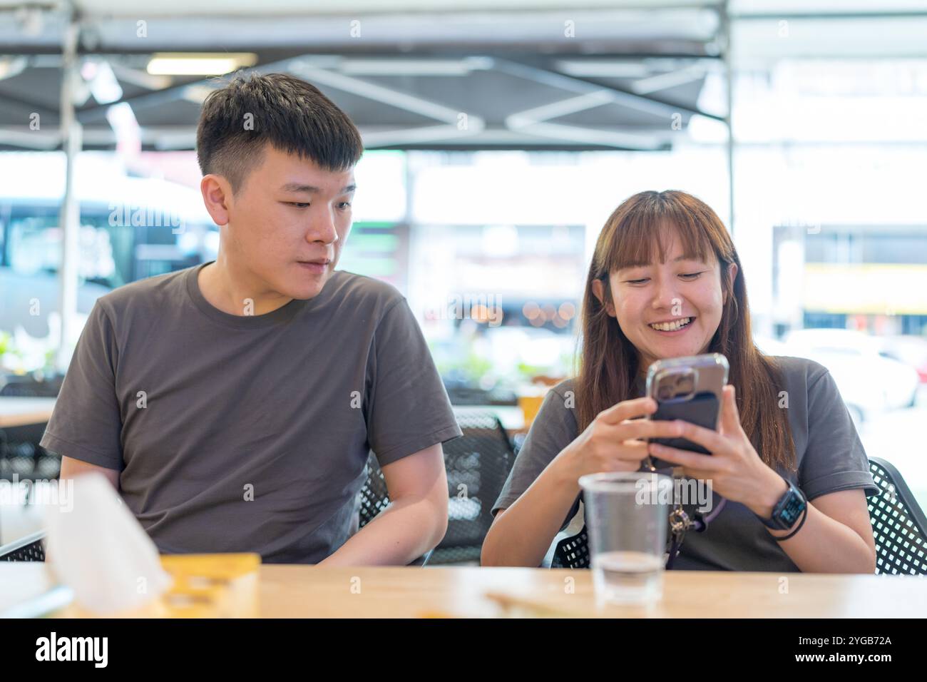 June 2024. A Chinese-Malaysian couple in their 30s chat while eating durian at a famous ...