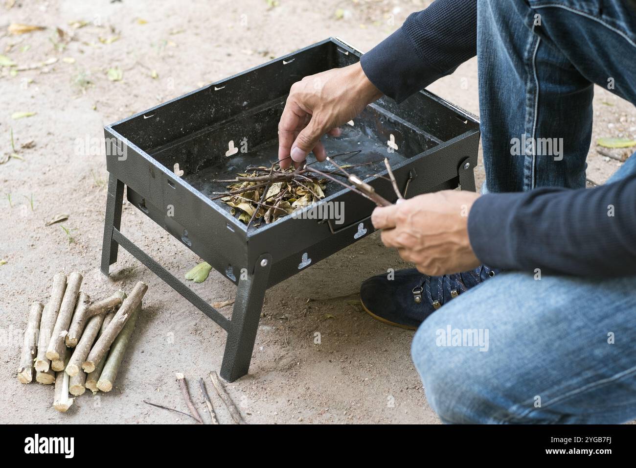 Lighting stove man hi-res stock photography and images - Alamy