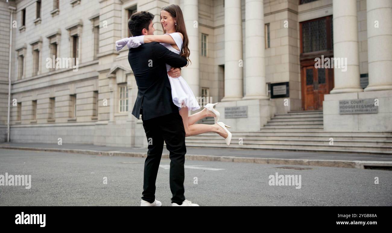 Wedding, carry and couple in city for spin at marriage ceremony ...