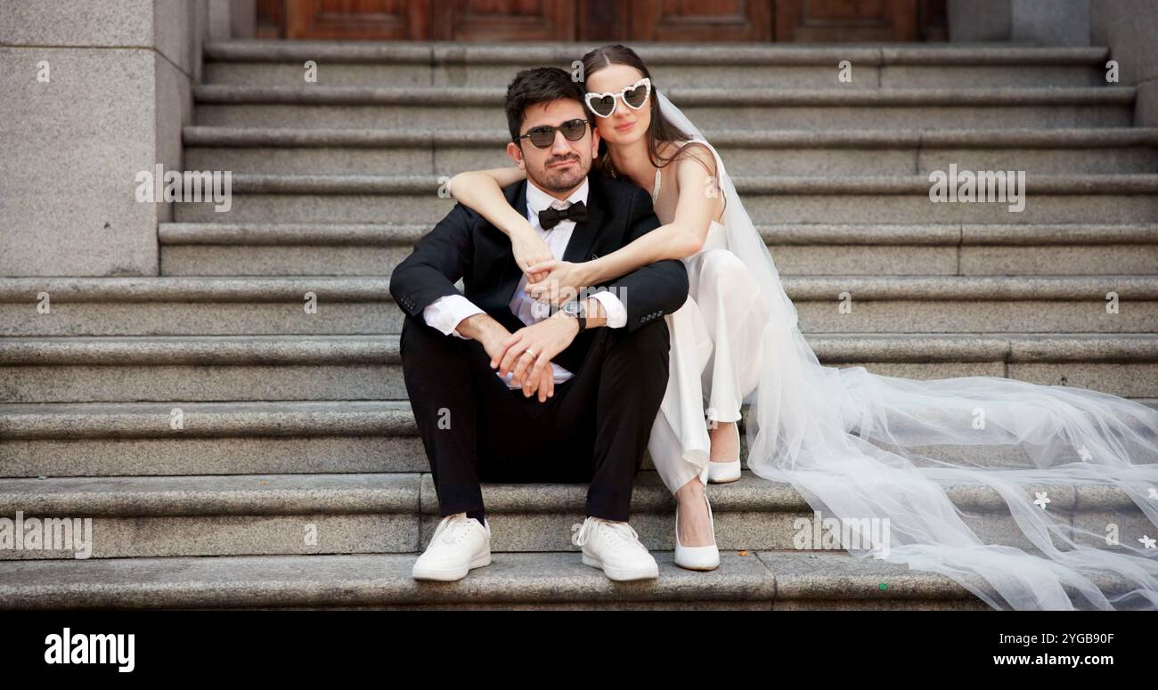 Bride sitting on steps bouquet hi-res stock photography and images - Alamy