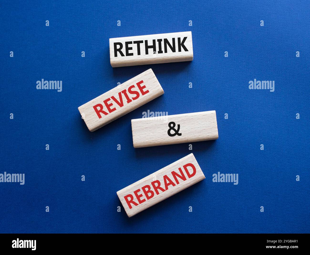 Rethink Revise and Rebrand symbol. Wooden blocks with words Rethink ...
