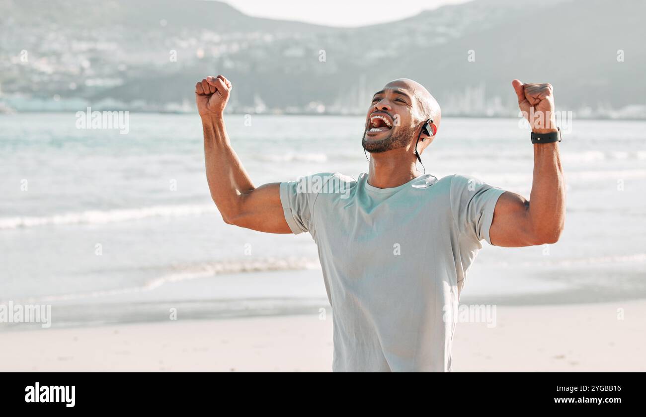 Beach, celebration and fitness with African man, achievement and ...