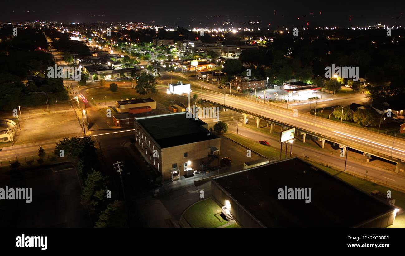 Long-exposure night shots of the cityscape capture vibrant light trails ...