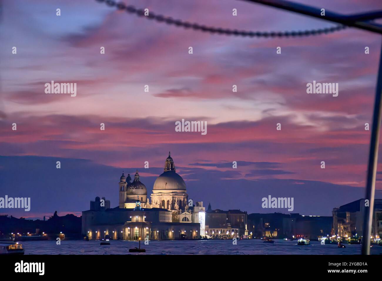 A breathtaking view of Venice at sunset. The city's iconic skyline is ...