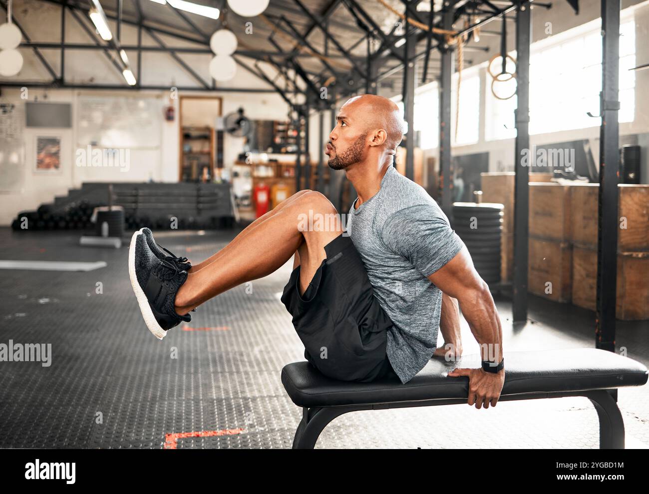 Bodybuilder, training and man for crunches, workout or fitness for core strength. Guy, endurance ...