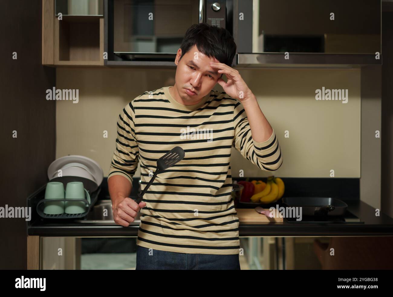 stress man in the kitchen room Stock Photo - Alamy