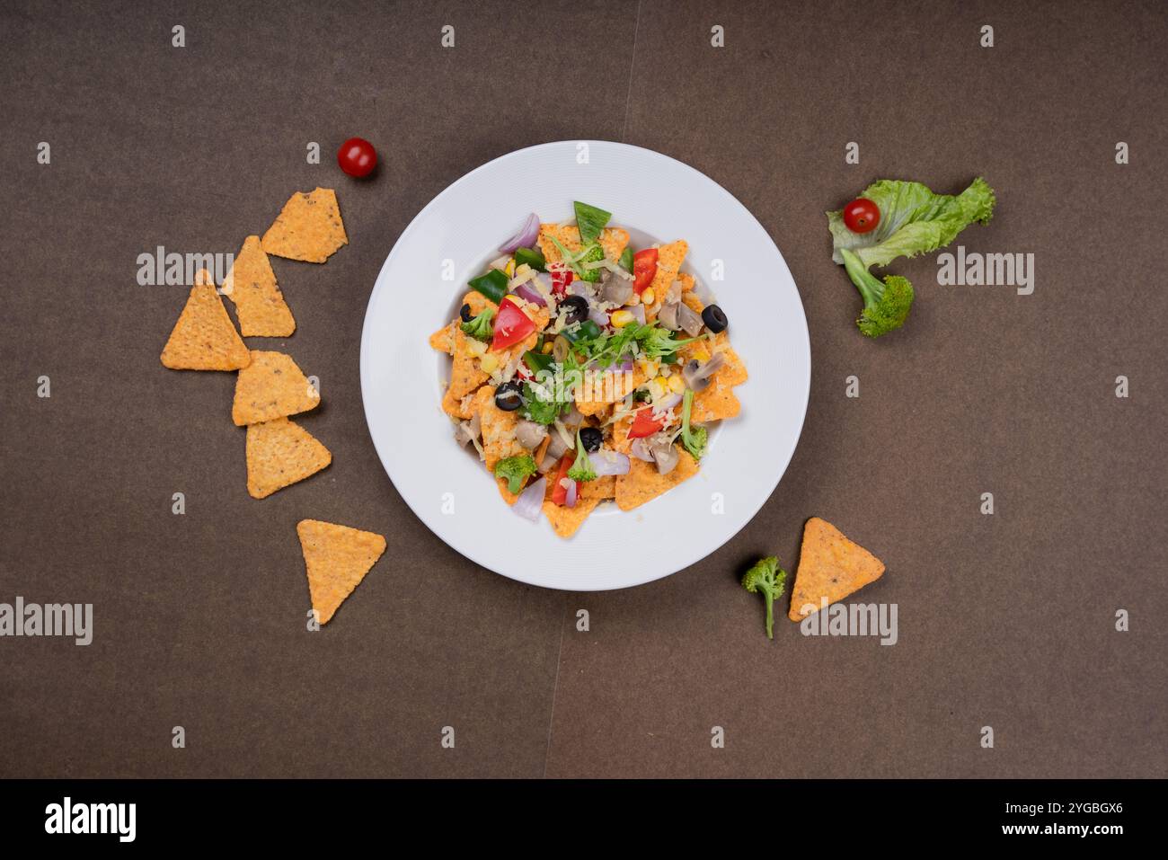 Mexican nachos salad with olives and broccoli Stock Photo - Alamy