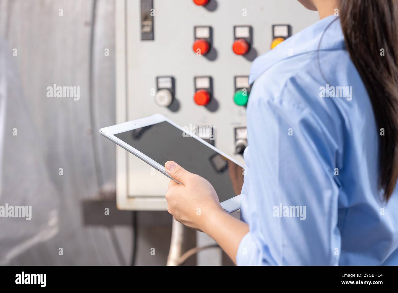 Engineer using Tablet software check service maintenance electricity main circuit fuse and power ...