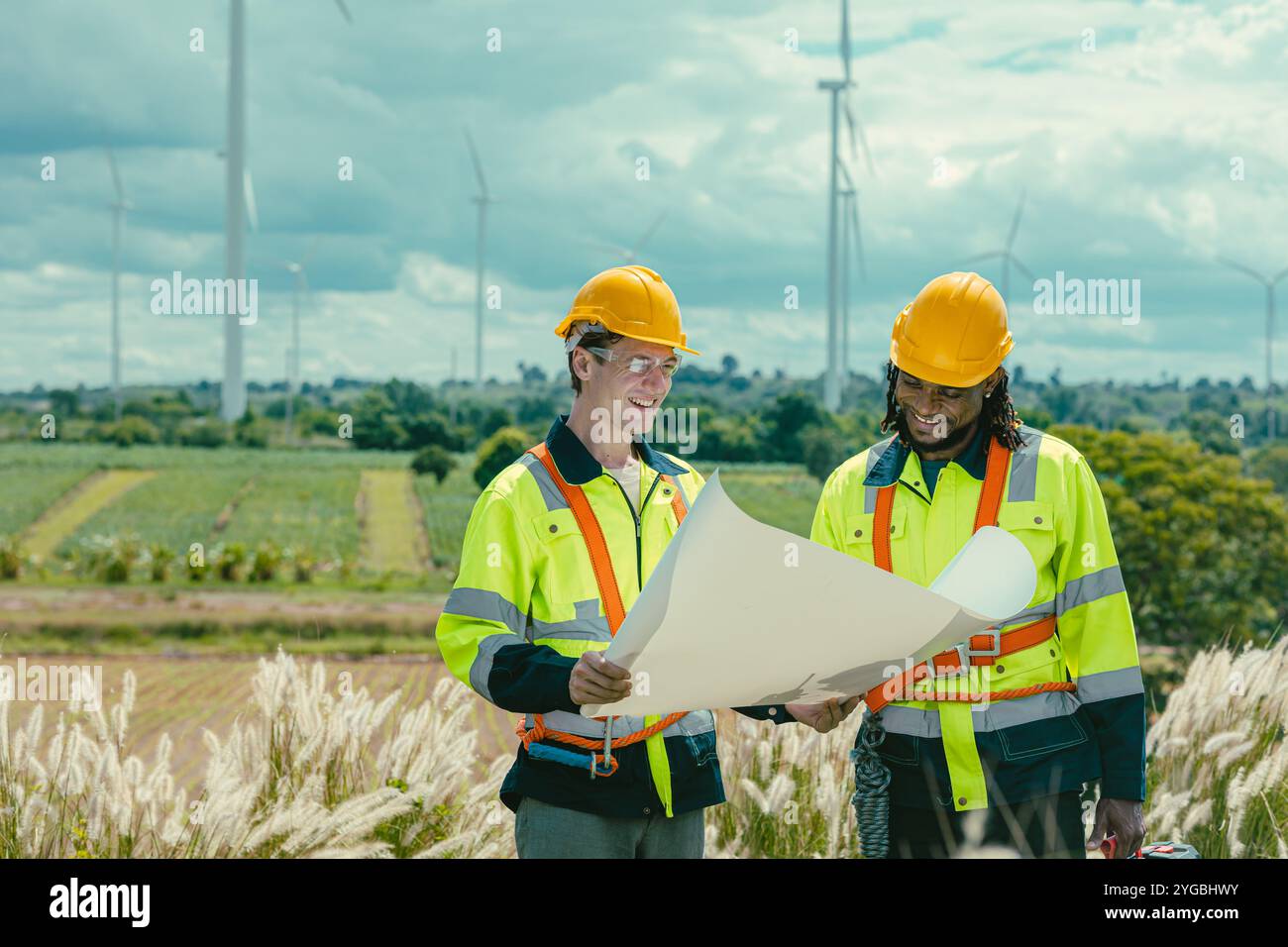 Engineer team mix black and white male workers with floor plan at Wind ...