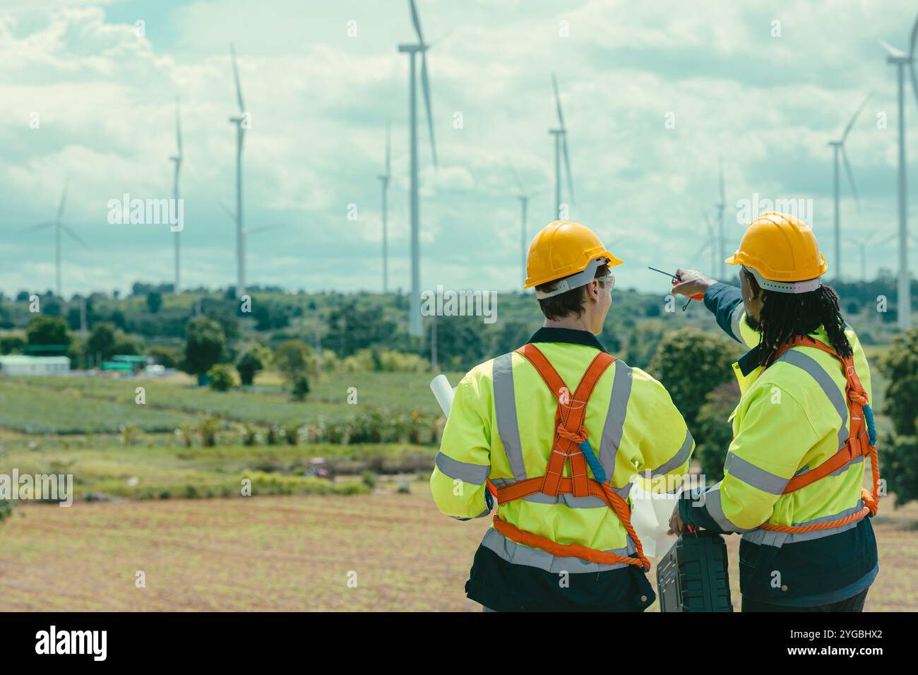 Engineer team mix black and white male workers with floor plan at Wind ...