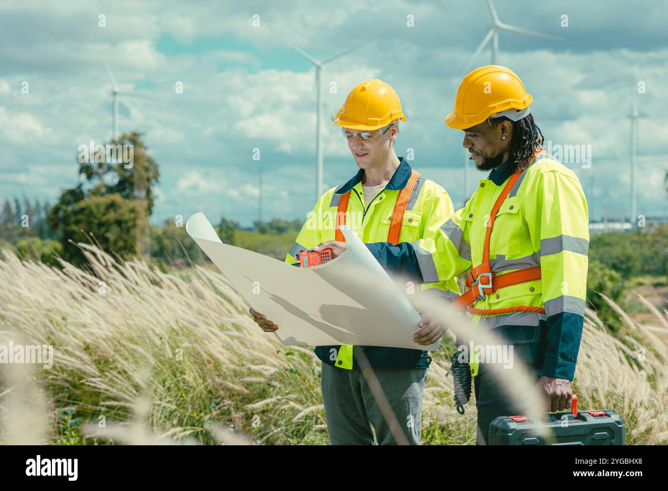 Engineer team mix black and white male workers with floor plan at Wind ...