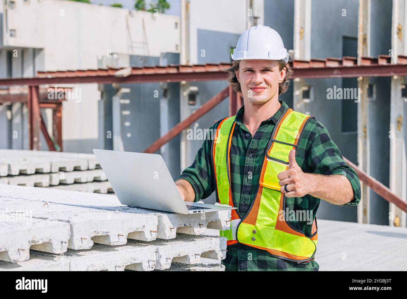 Professional engineer Caucasian male working in concrete precast plant ...