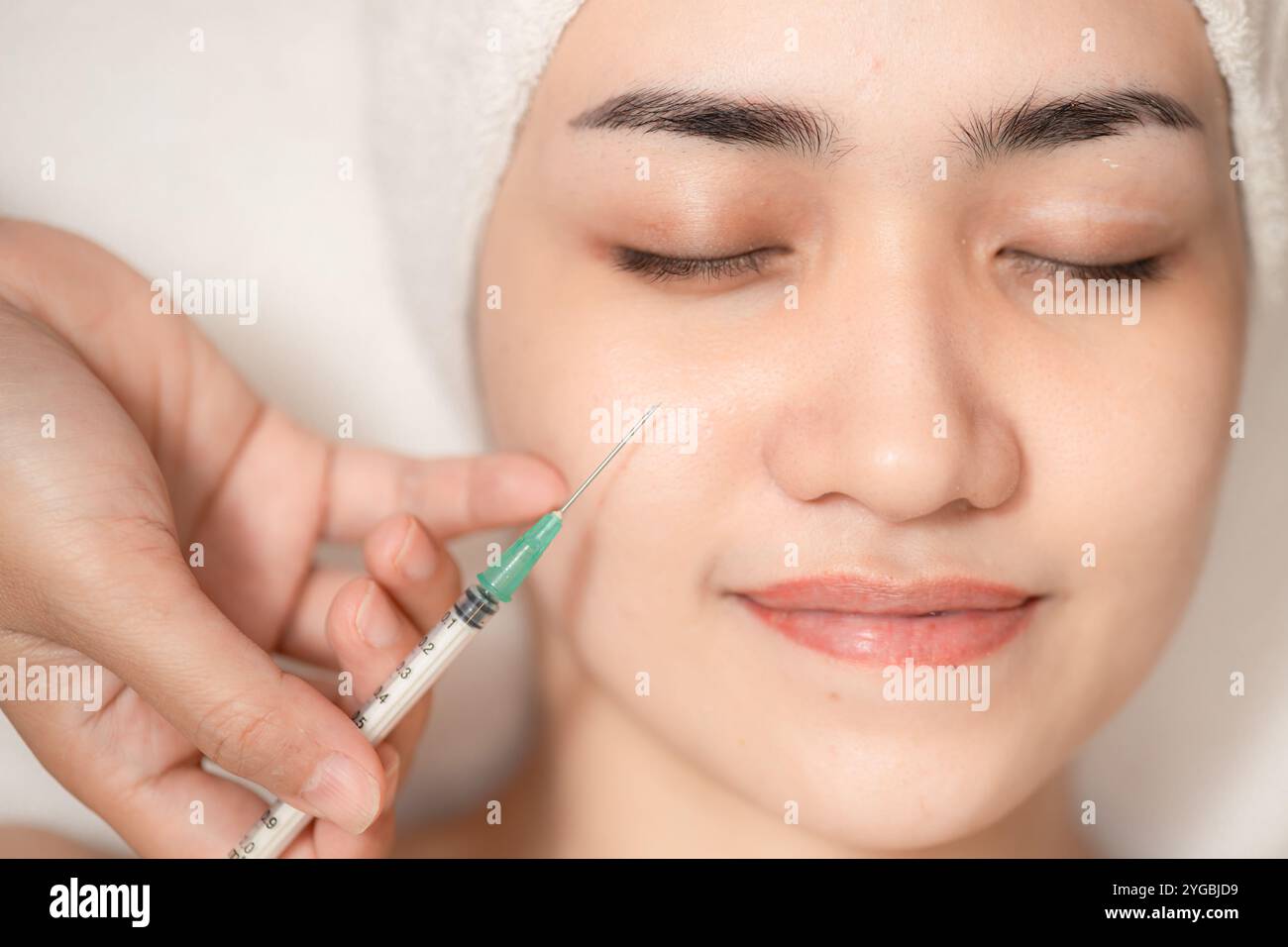 Woman needle injection facelift. Medical Filler for face lifting remove wrinkles in facial spa ...