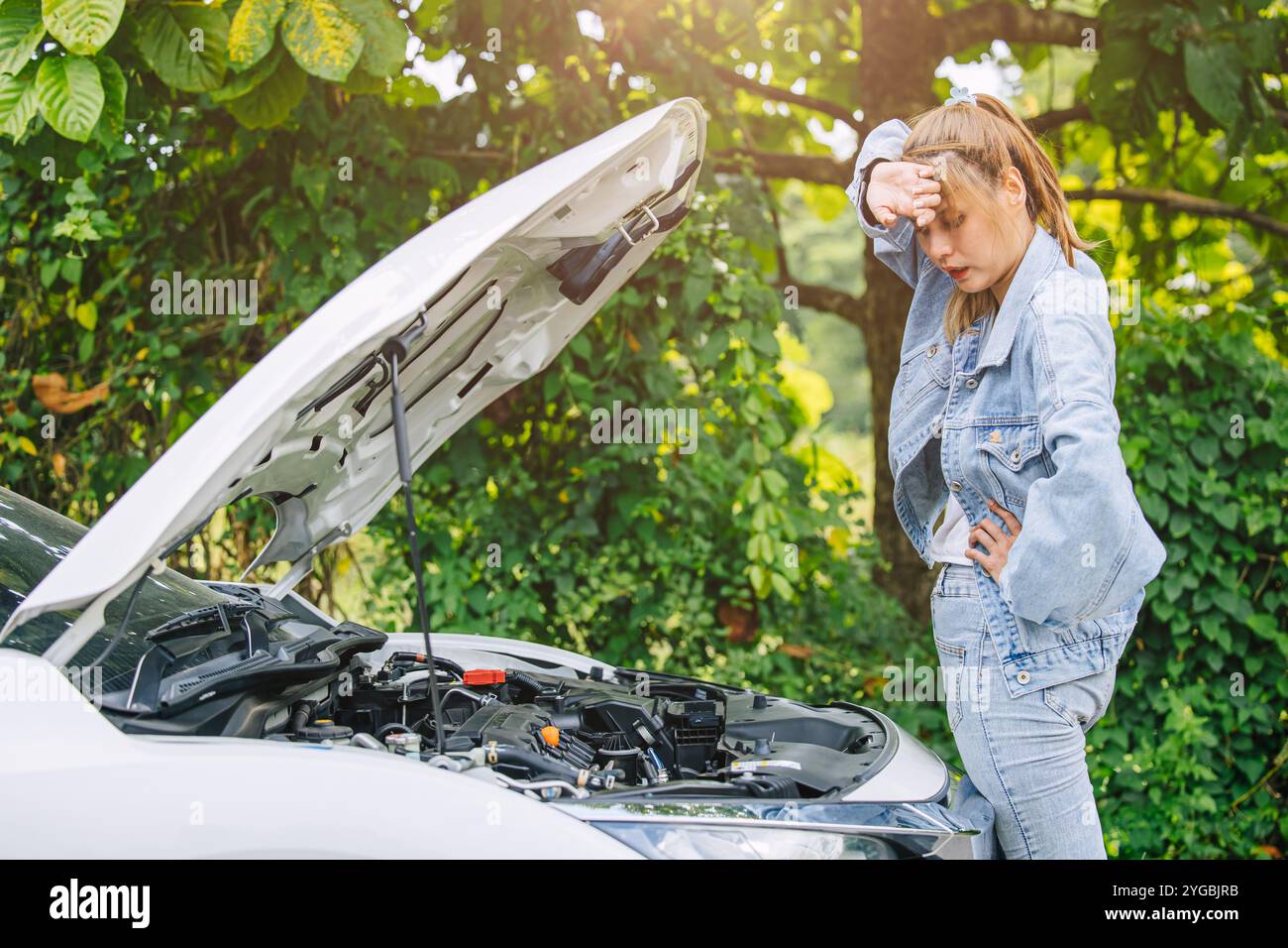Women car problem engine breakdown alone at roadside during travel trip ...