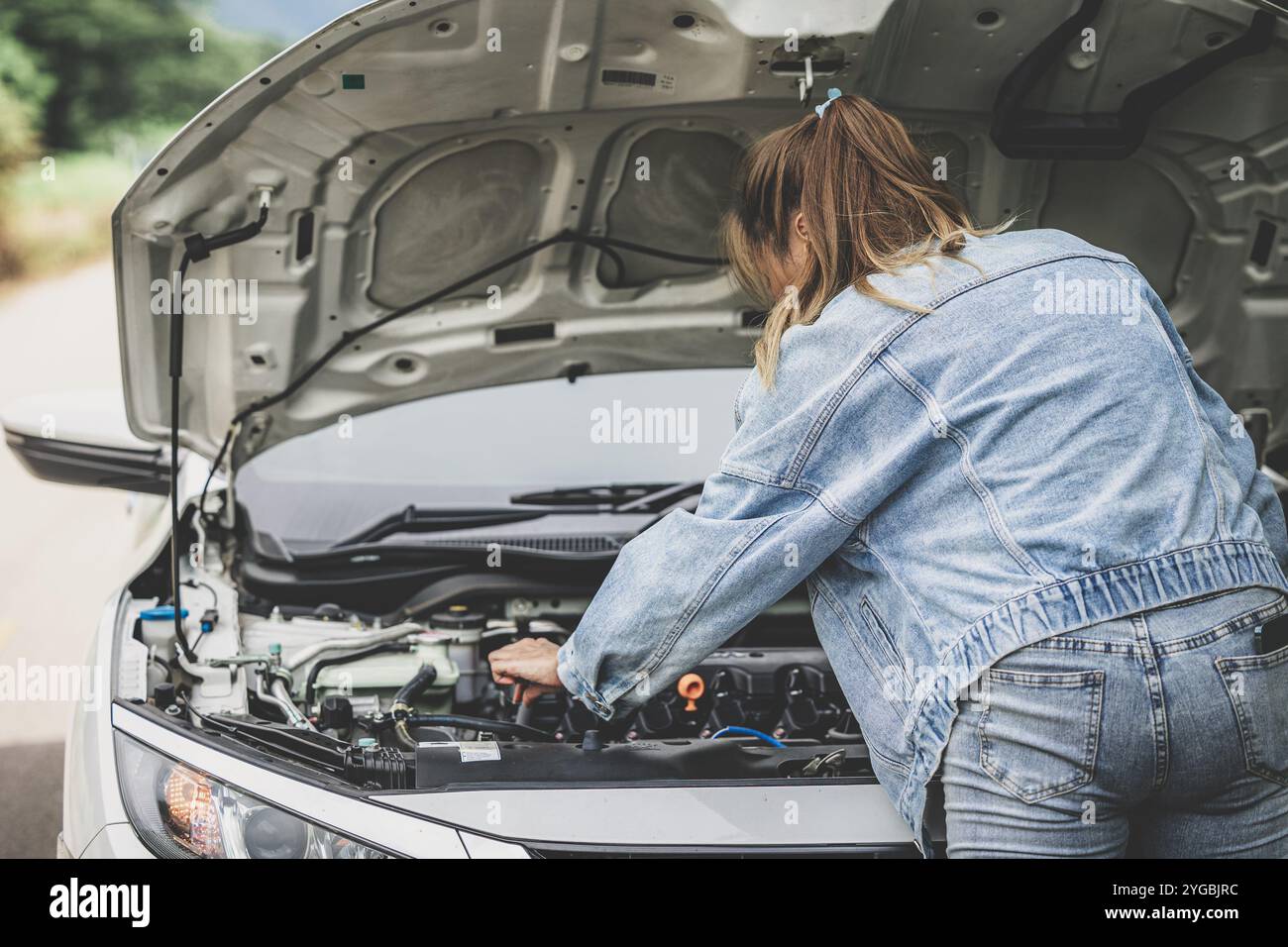 Women car problem engine breakdown alone at roadside during travel trip ...