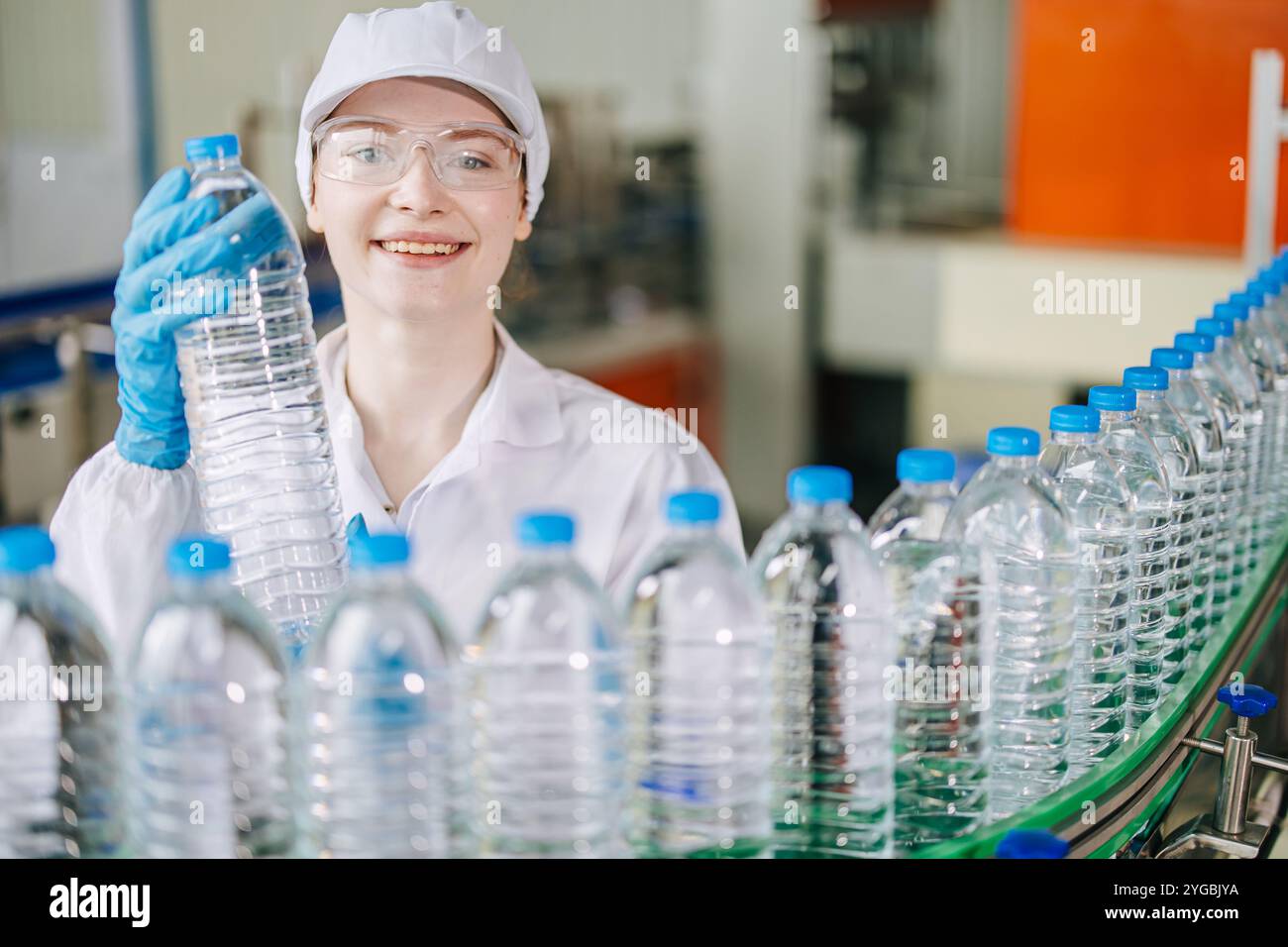Portrait happy young women worker quality control in Drinking water ...