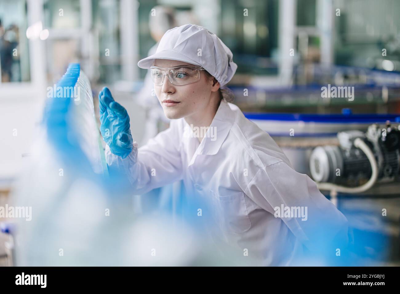 Women worker focus working care quality control in Drinking water ...