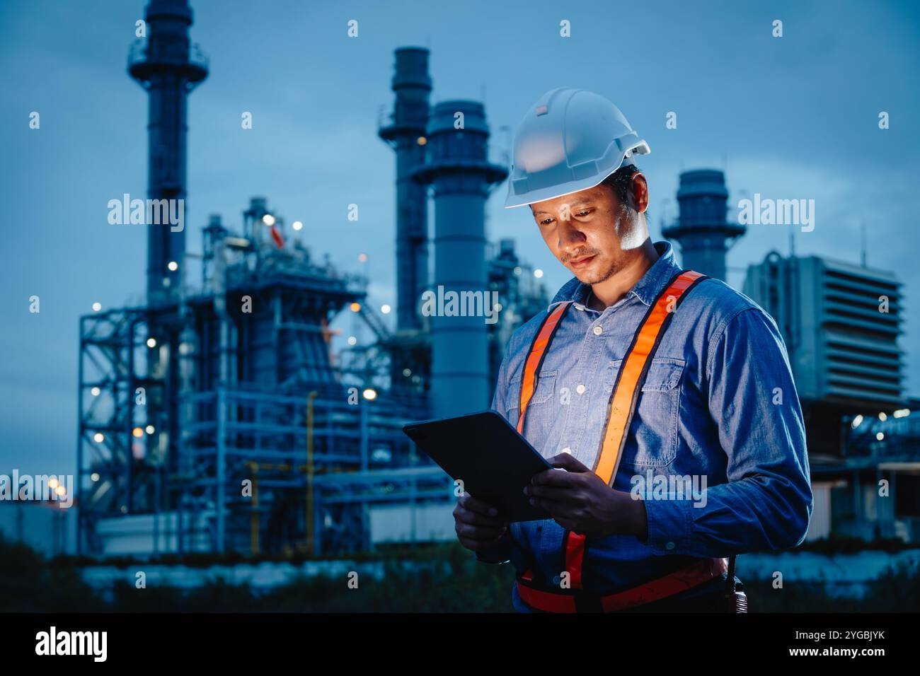 Night shift engineer oil and gas refinery service, male worker hard ...