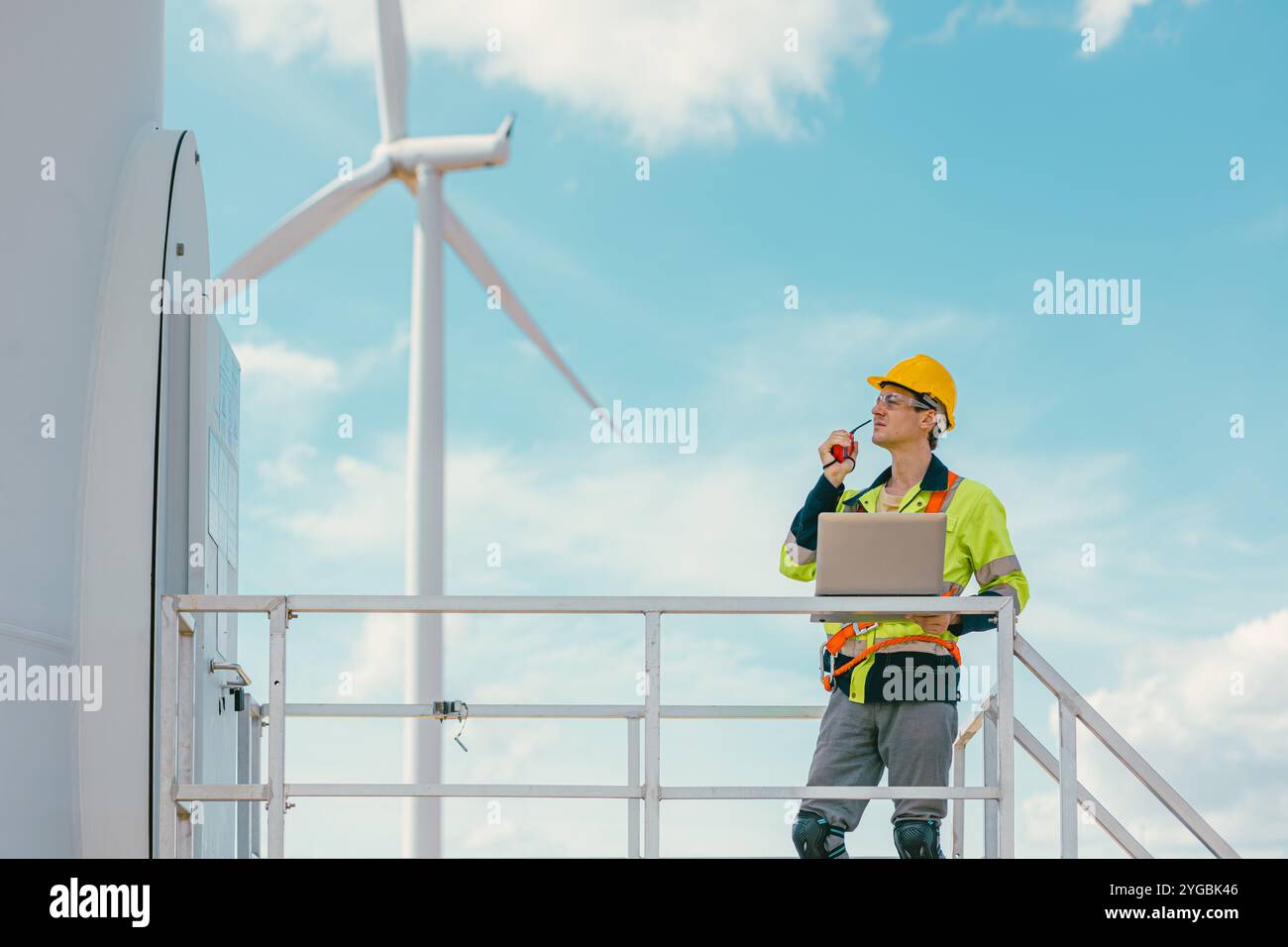 Engineer workers working outdoor with safety at wind turbines clean ...