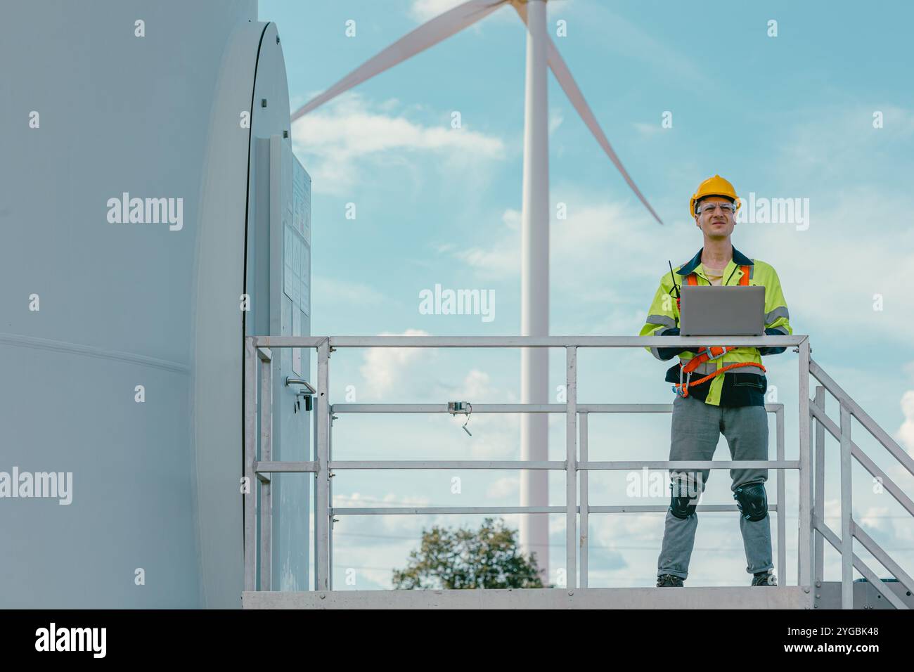 Engineer workers working outdoor with safety at wind turbines clean ...