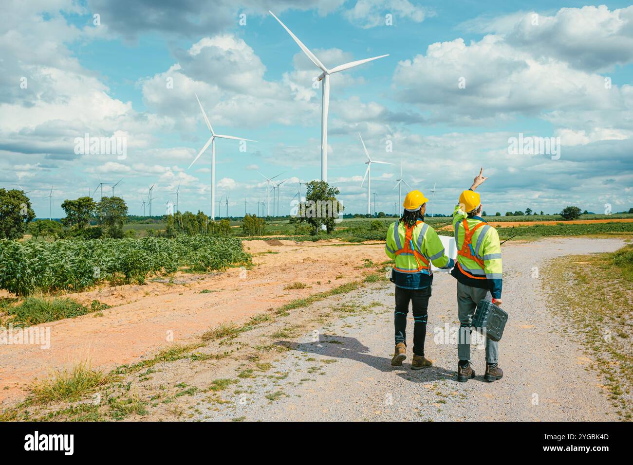 Engineer workers working outdoor with safety at wind turbines clean ...
