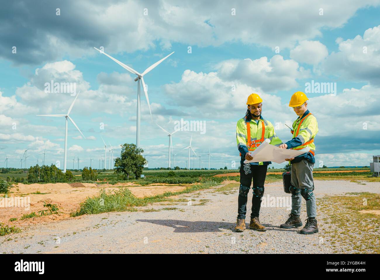 Engineer workers working outdoor with safety at wind turbines clean ...