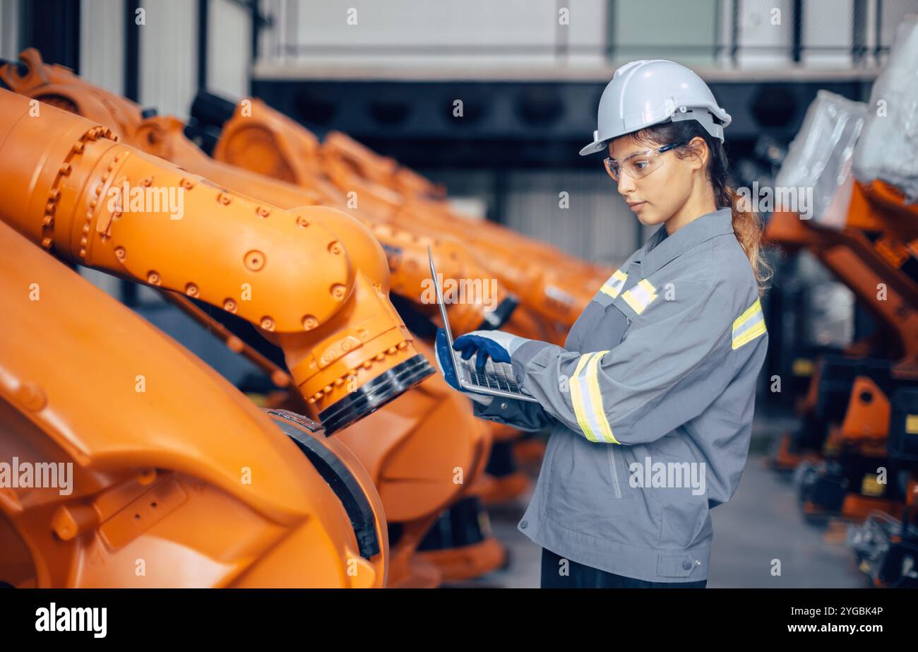 Engineer woman working in advance machine factory. Indian female ...