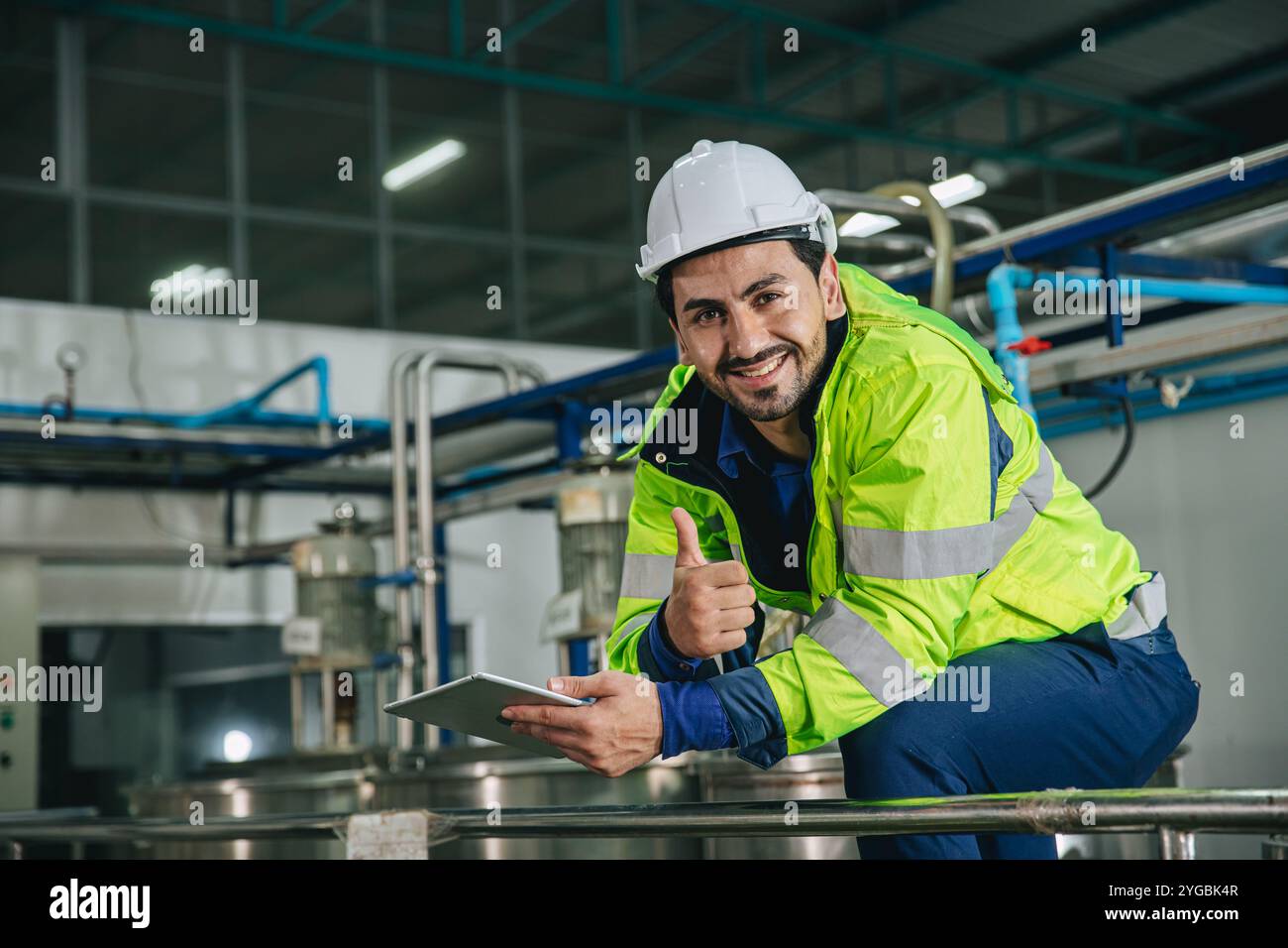 Portrait of satisfied happy smiling factory manager. Engineer wearing ...