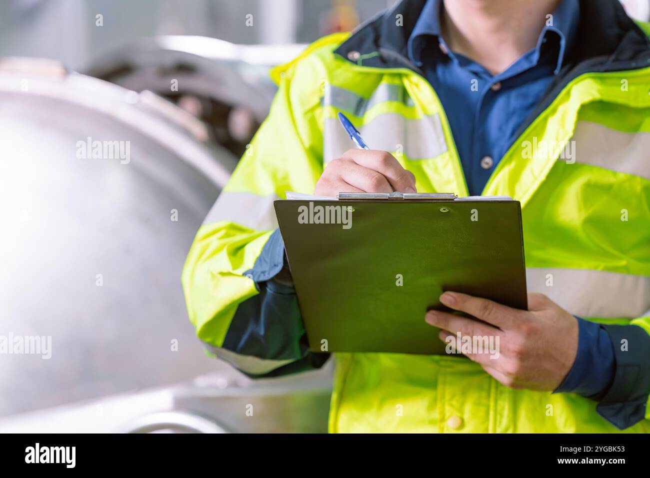 Technician engineer routine working monitor temperature in boiler room ...
