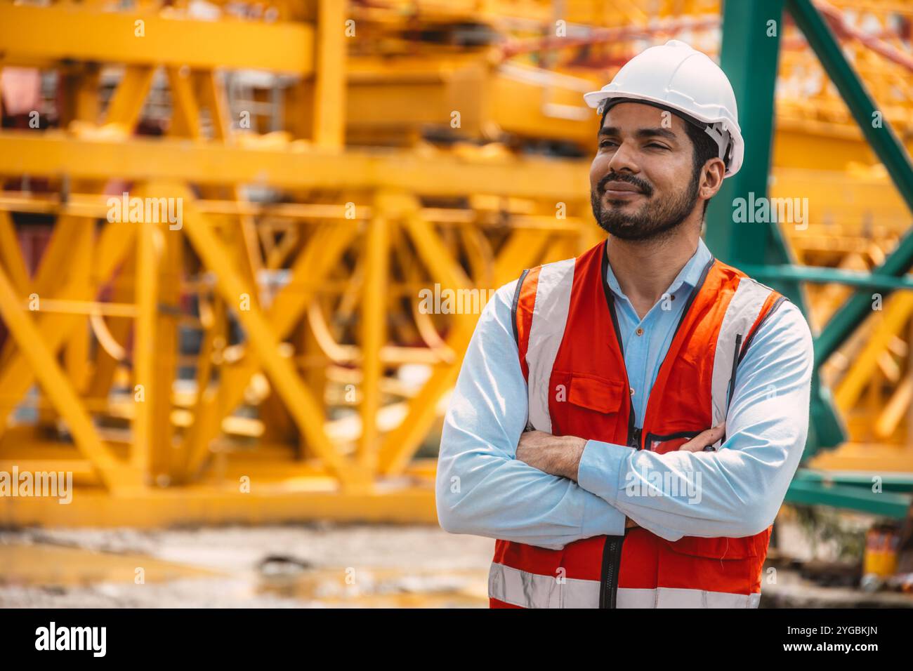 Smart Happy confident Indian construction worker standing smile arm ...