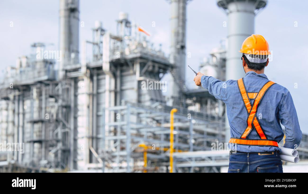 Petroleum Refinery industry engineer male working against oil and gas ...