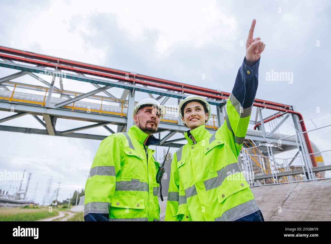 Engineer oil and gas refinery pipe service team worker working together ...