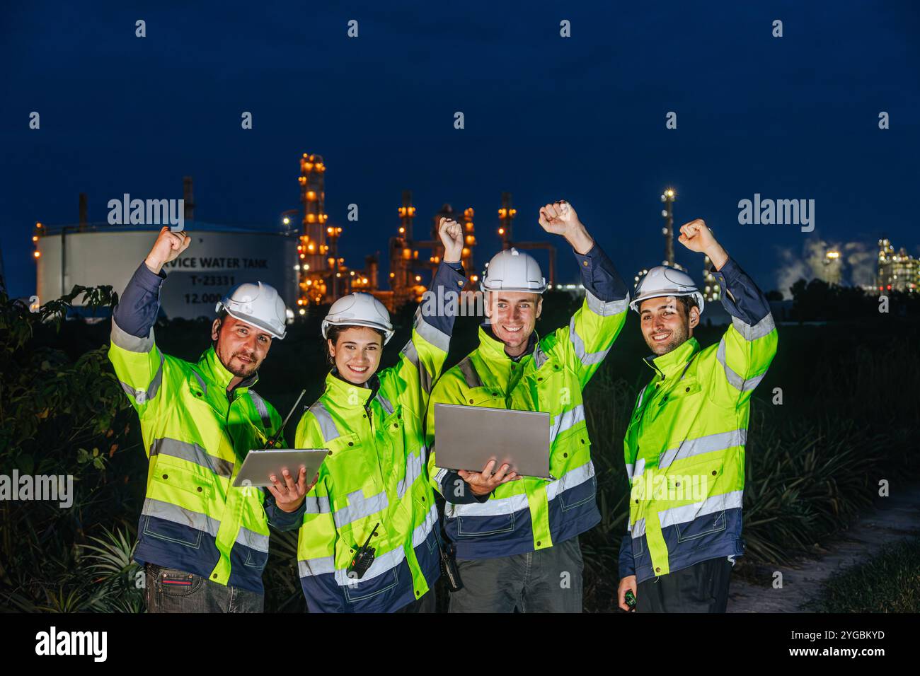 Group of Night Shift Oil And Gas Refinery Engineer Team Workers ...
