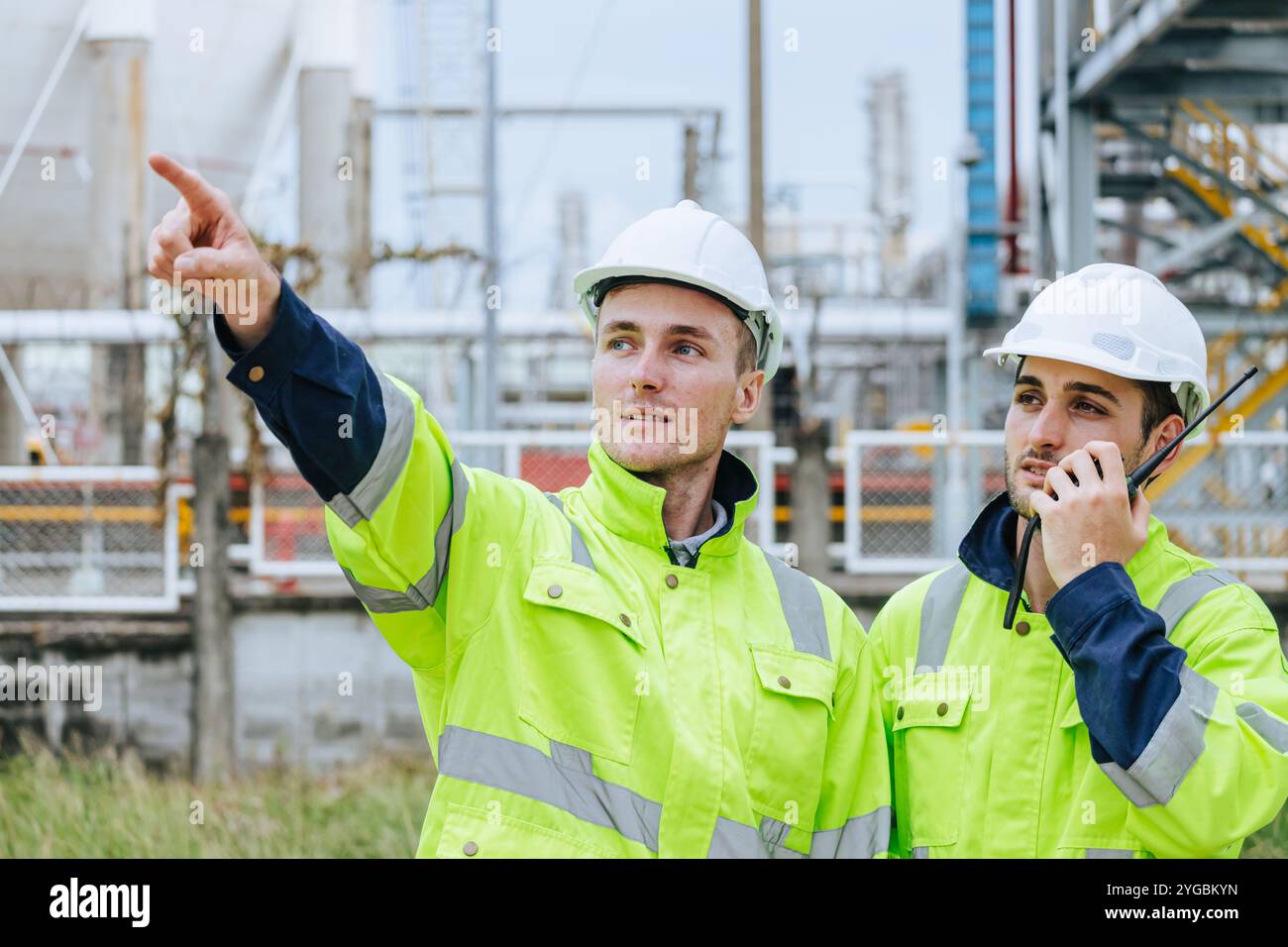 Engineer oil and gas refinery pipe service team worker working together ...