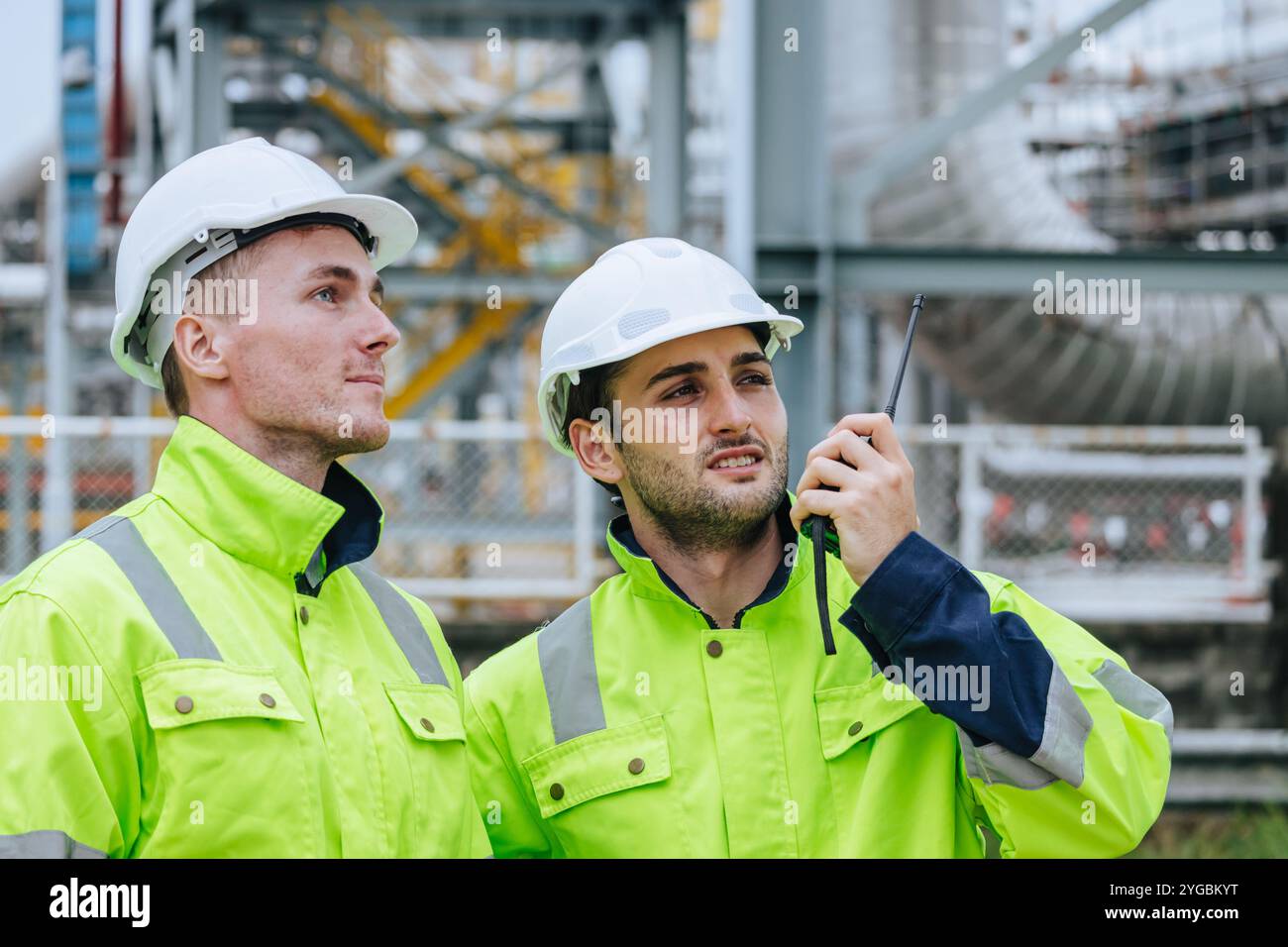 Engineer oil and gas refinery pipe service team worker working together ...