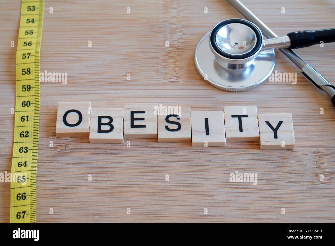 OBESITY. Wooden letters with tape measure and stethoscope Stock Photo ...