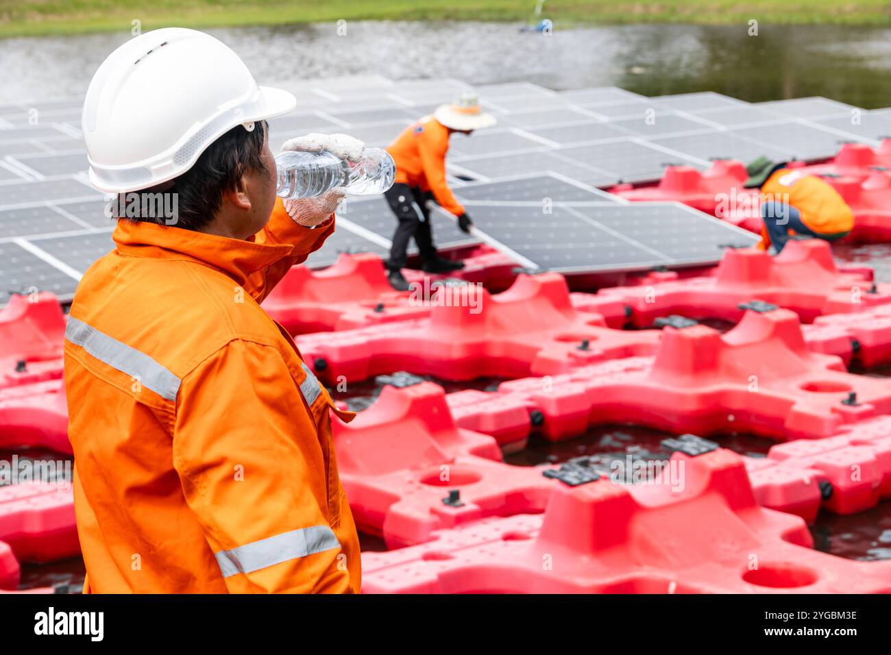 Tired Engineer Worker Man Drinking Water Control Operate Floating Solar ...