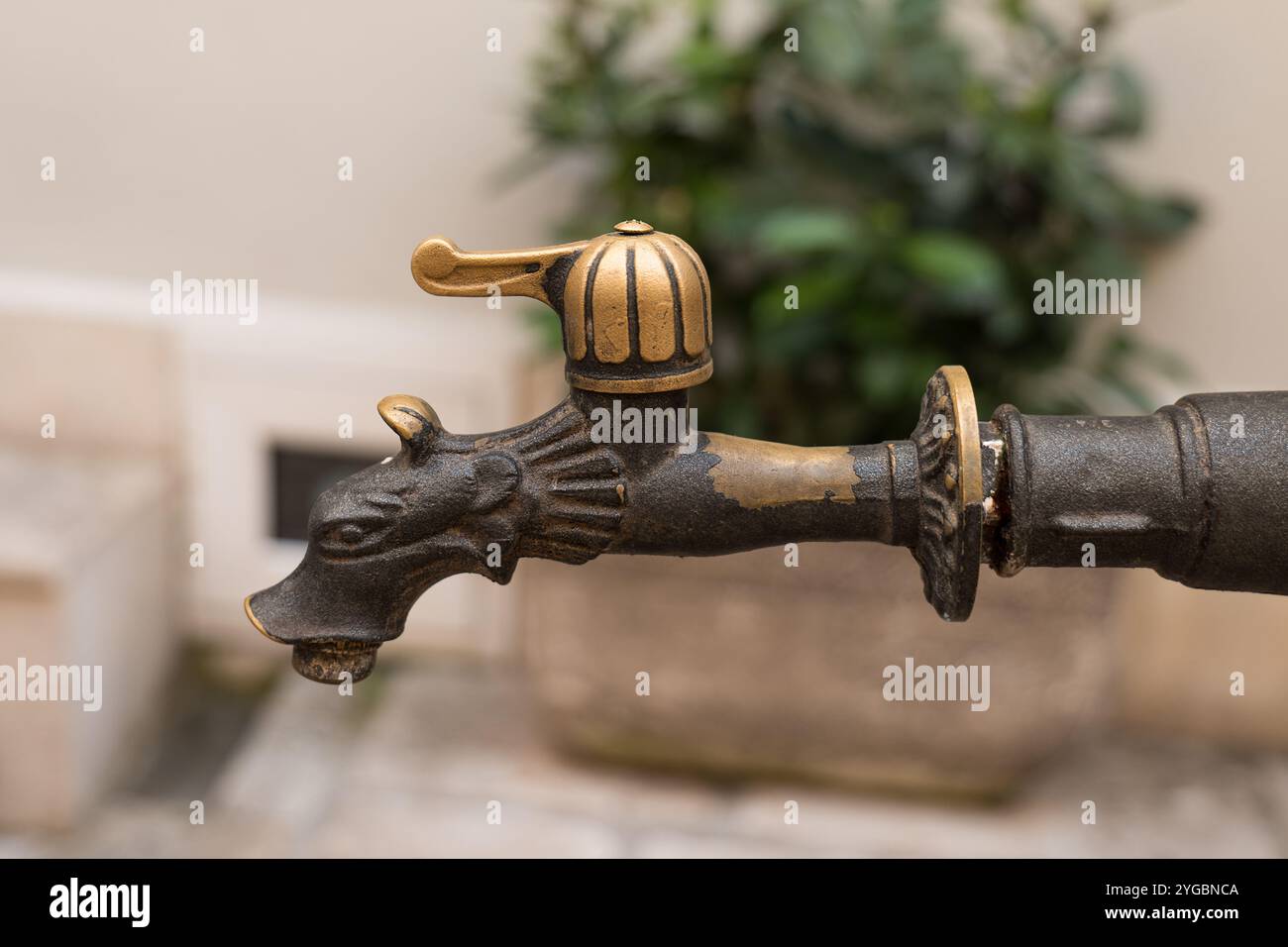 Old antique faucet in medieval town Stock Photo - Alamy