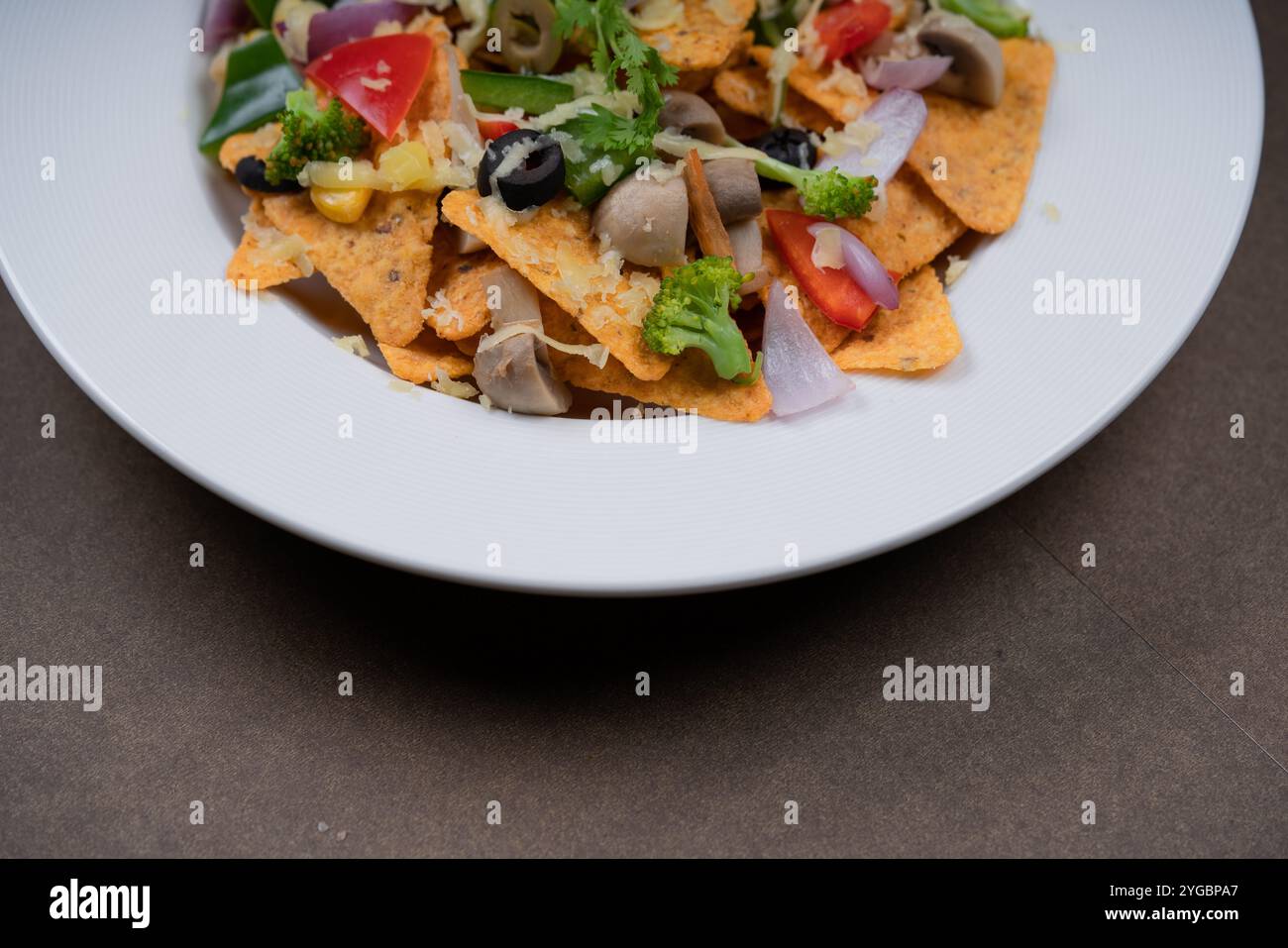 Mexican nachos salad with olives and broccoli Stock Photo - Alamy