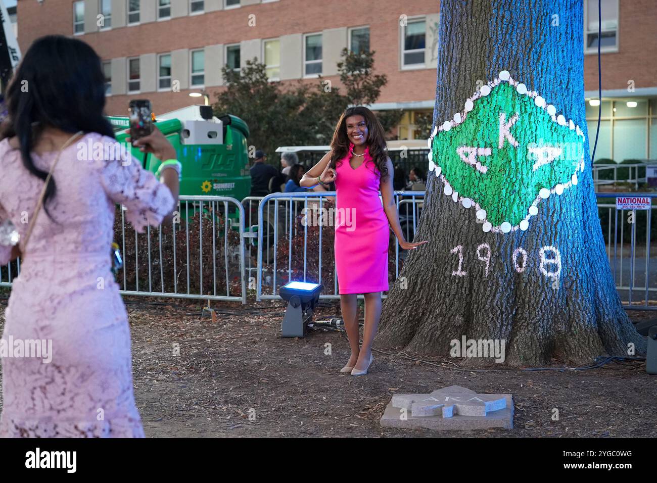 Women wearing the colors of the Alpha Kappa Alpha (AKA) sorority take ...