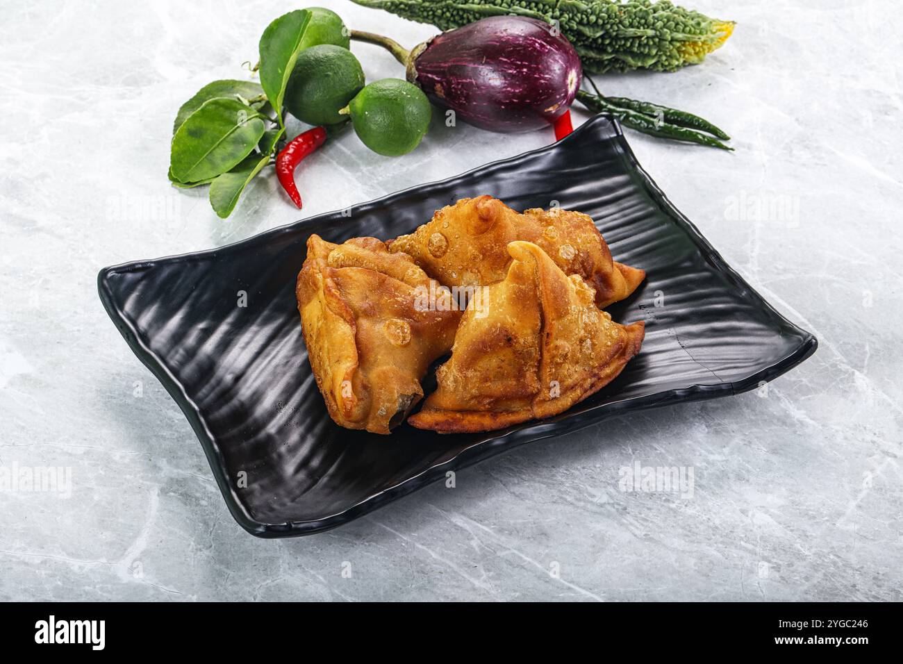 Indian cuisine - fries crispy stuffed samosa Stock Photo - Alamy