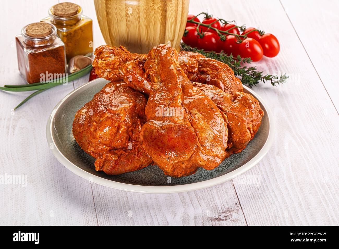 Raw turkey shoulder wing in Indian tandoori marinade spices Stock Photo ...