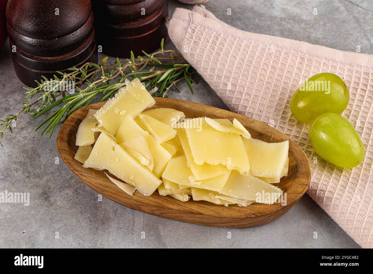 Aged Parmesan cheese slices in the bowl Stock Photo - Alamy