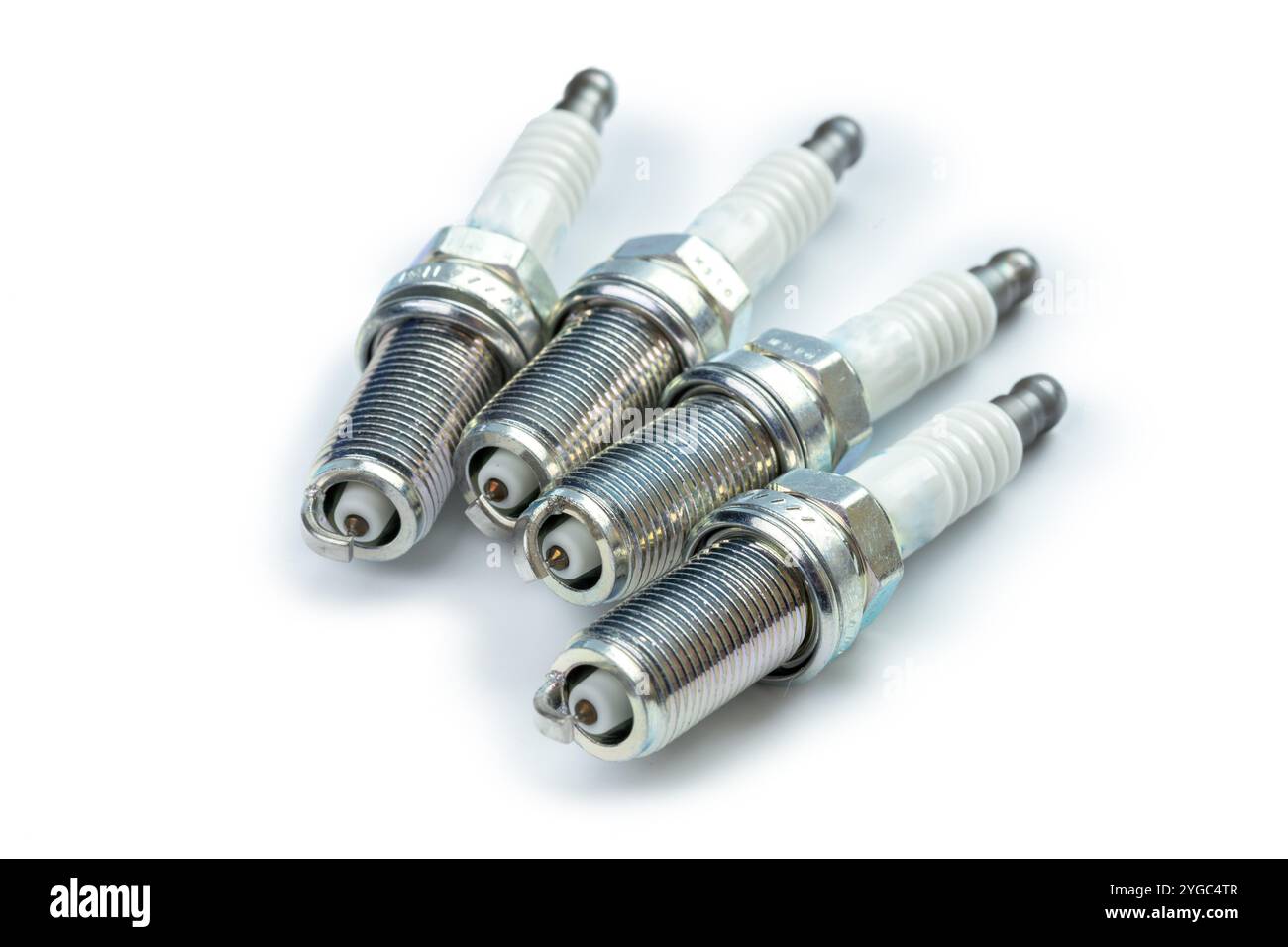 spark plugs isolated on white Stock Photo - Alamy