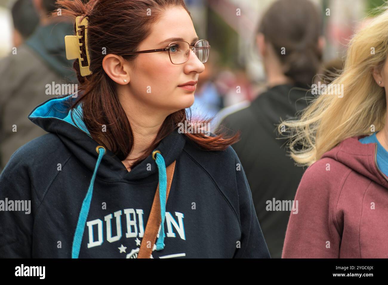 Street portrait of Dublin’s woman. A blonde young woman in a black ...